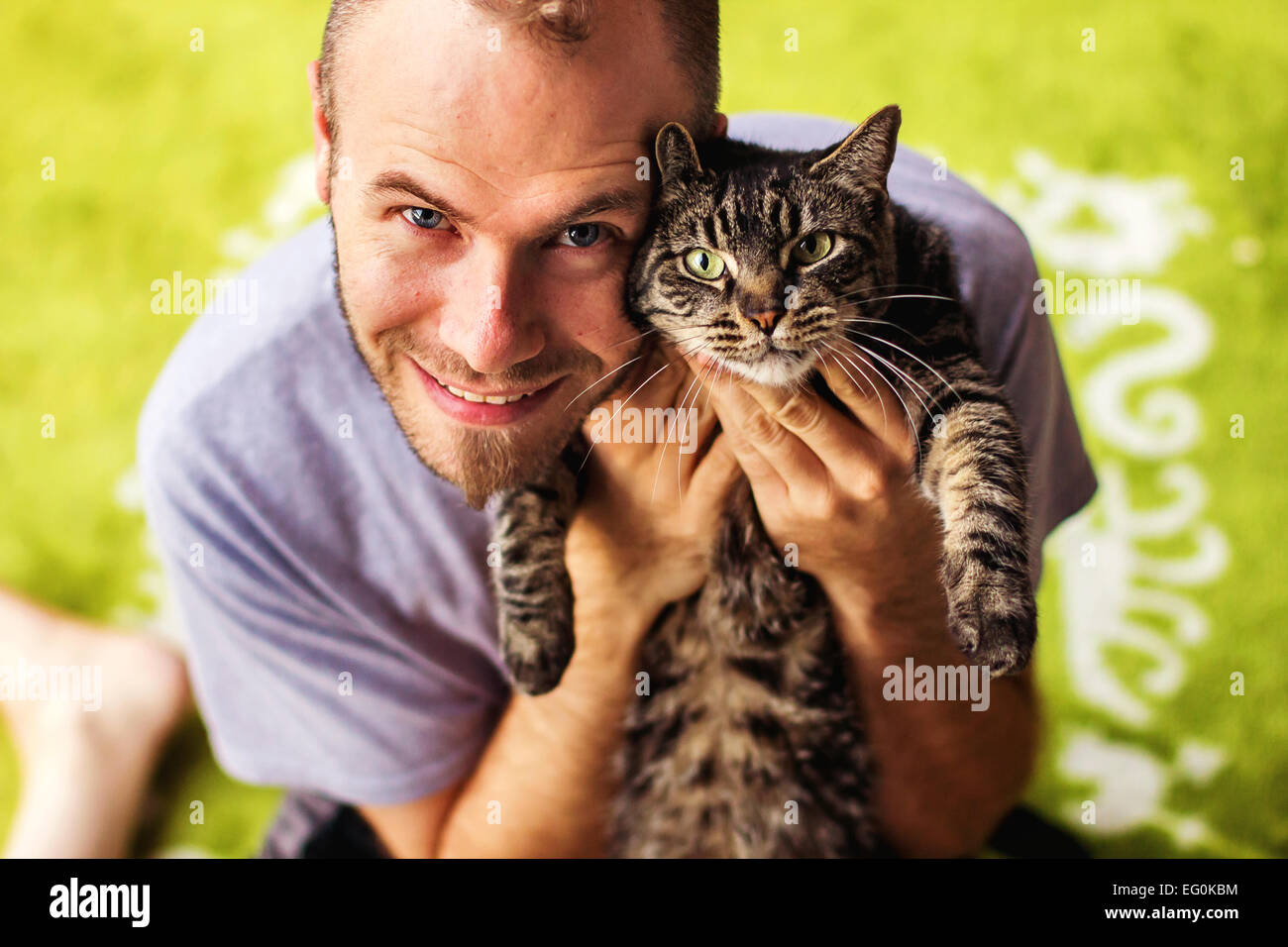 Man holding cat hi-res stock photography and images - Alamy