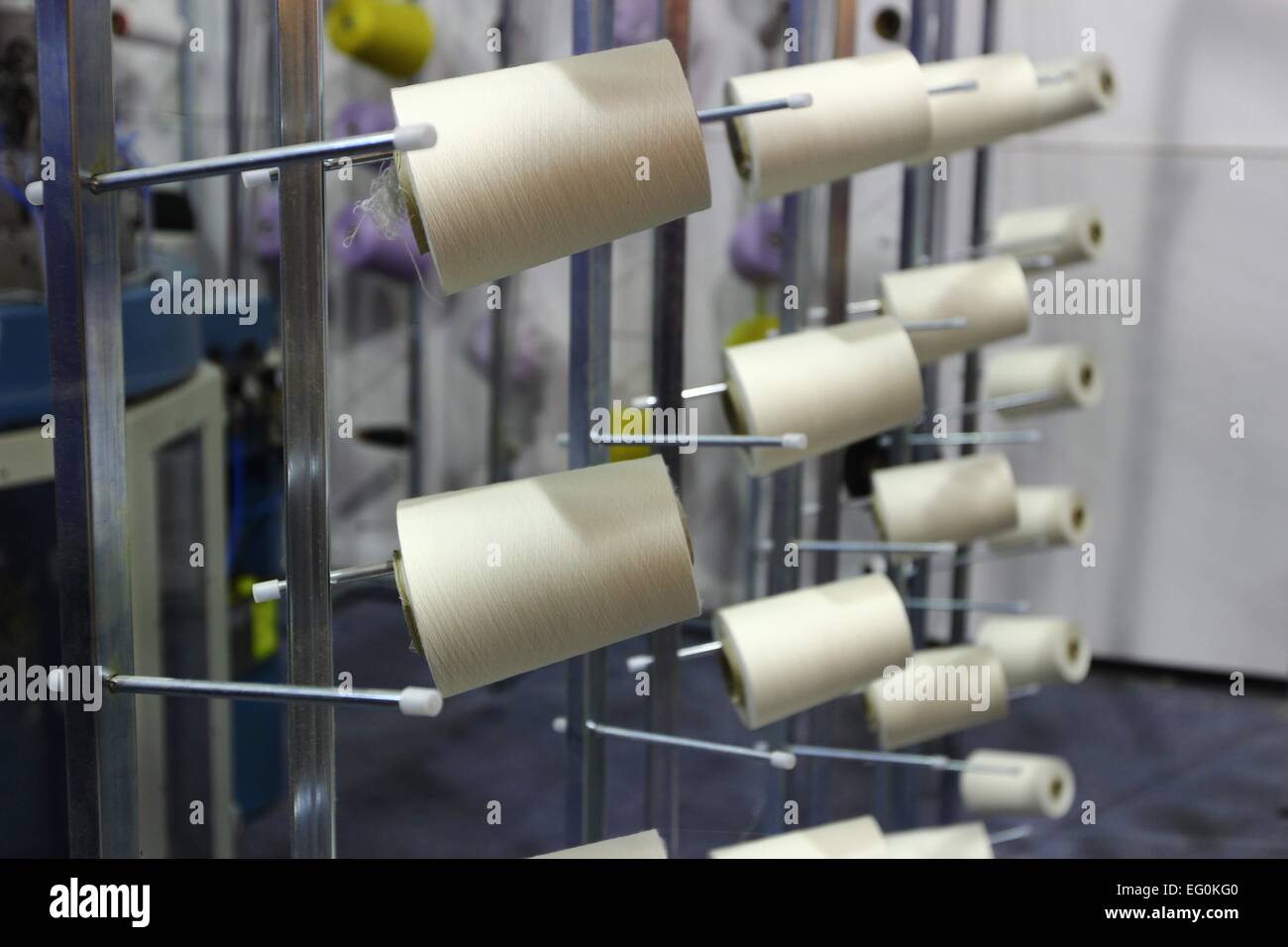 Dhaka 09 February 2015. Group of bobbin thread cones on a warping ...
