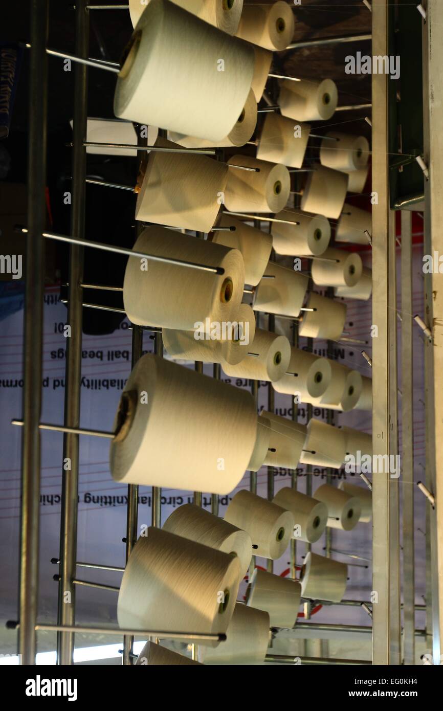 Dhaka 09 February 2015. Group of bobbin thread cones on a warping ...
