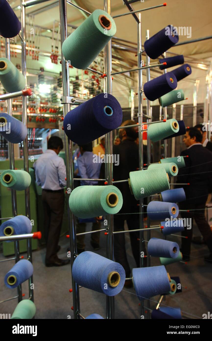 Dhaka 09 February 2015. Group of bobbin thread cones on a warping ...
