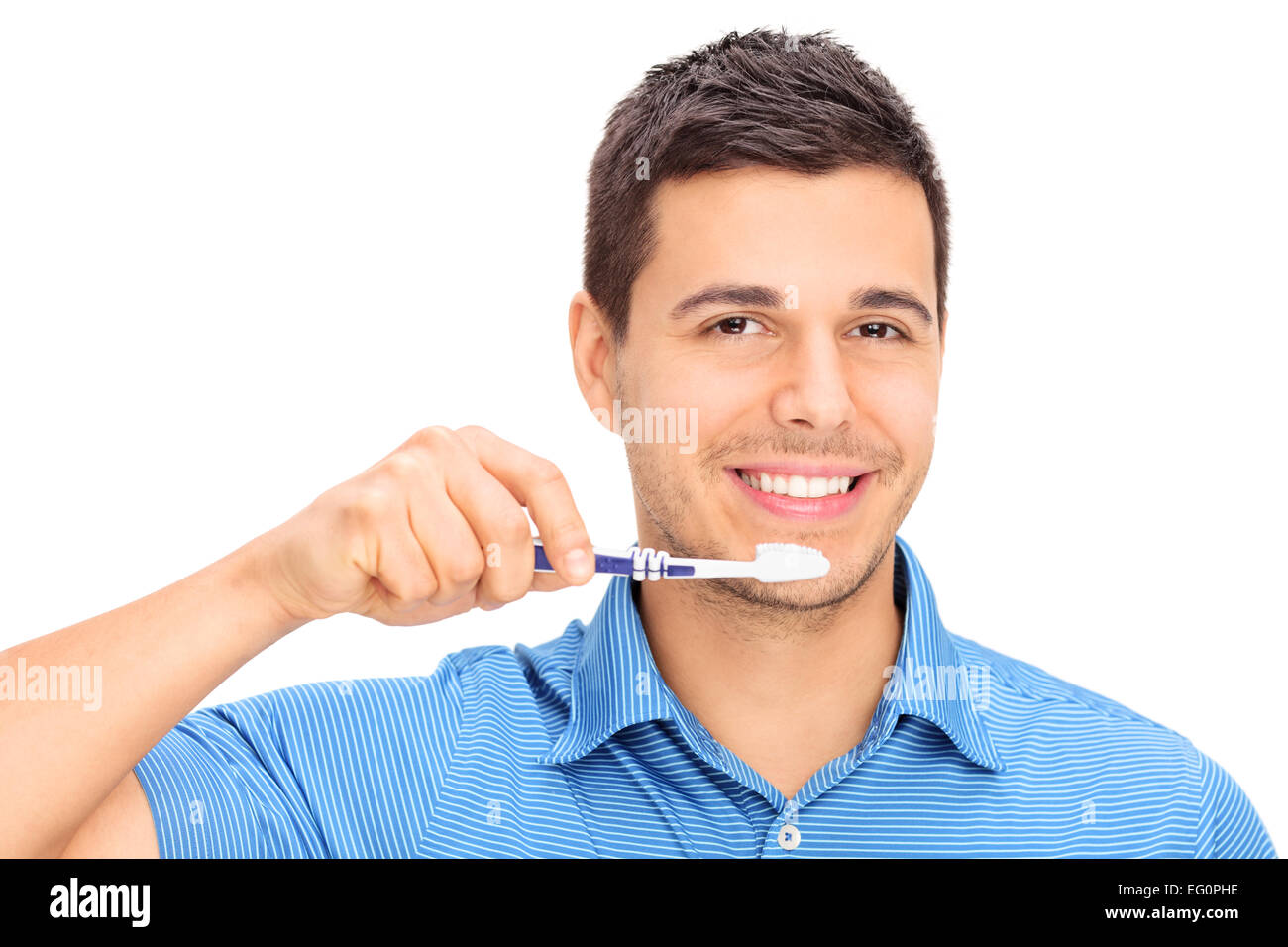 Young guy brushing his teeth isolated on white background Stock Photo ...