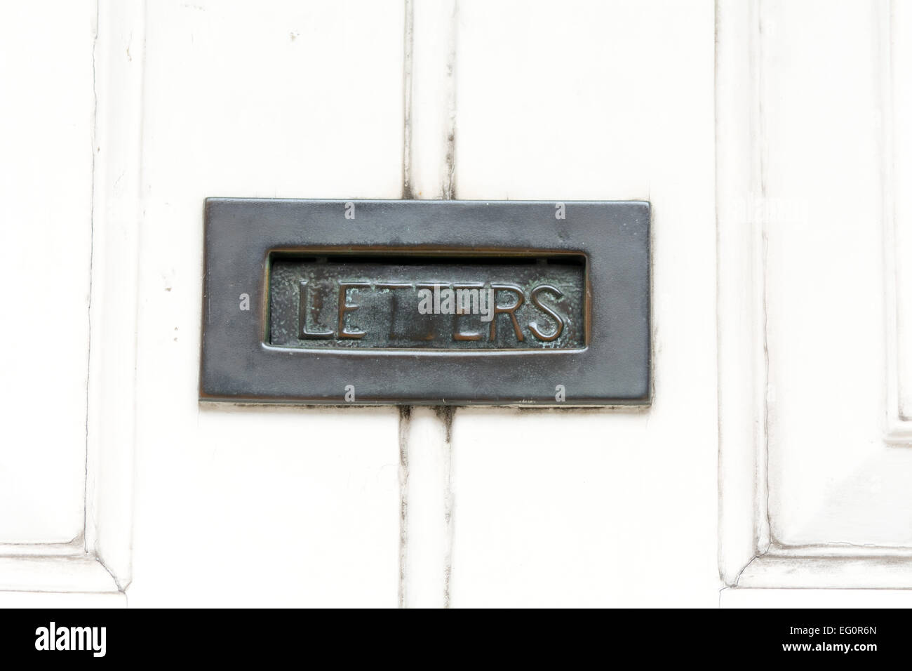 Brass letter box in door Stock Photo - Alamy