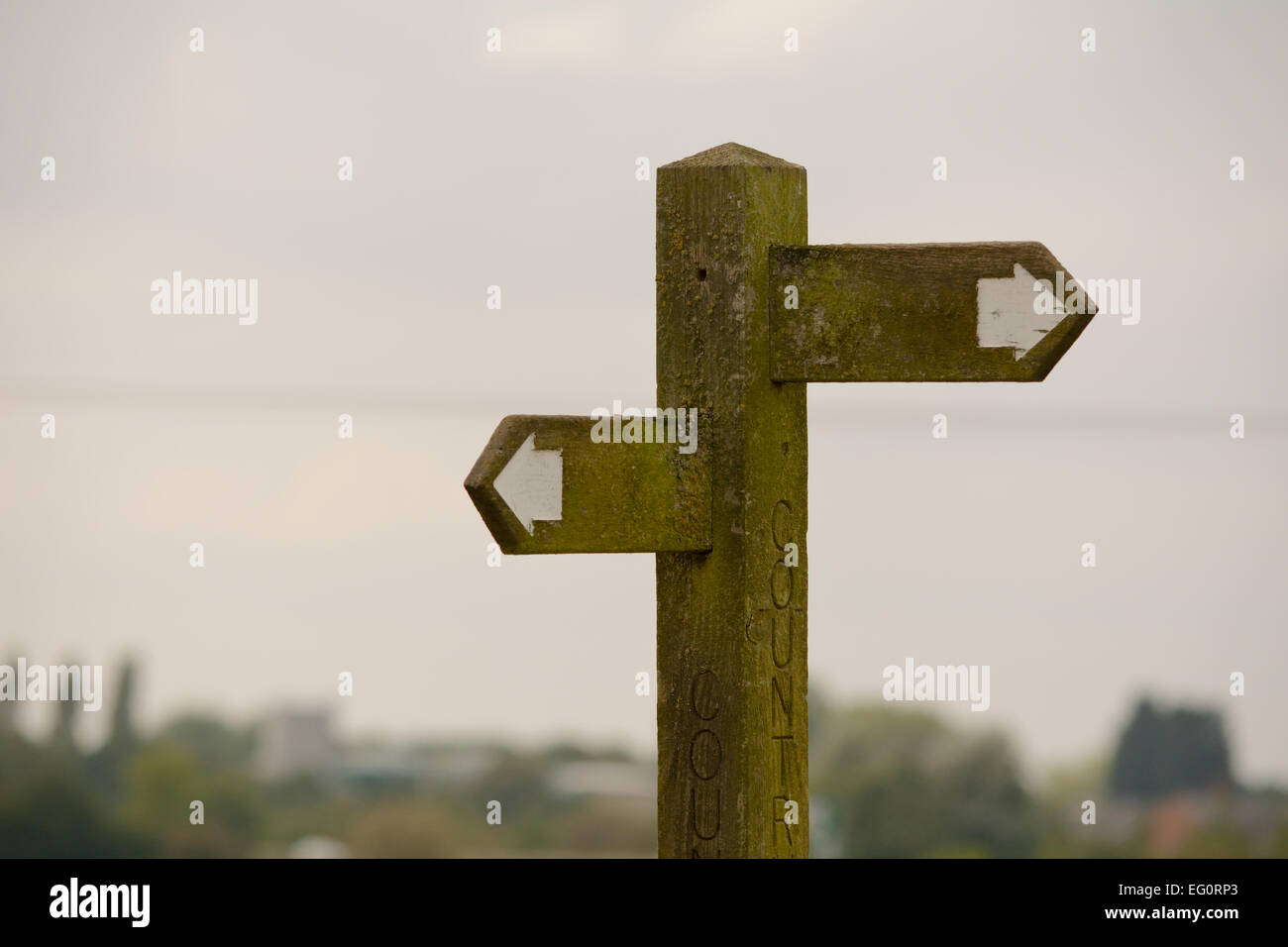 Wooden direction post with arms pointing in different directions Stock ...