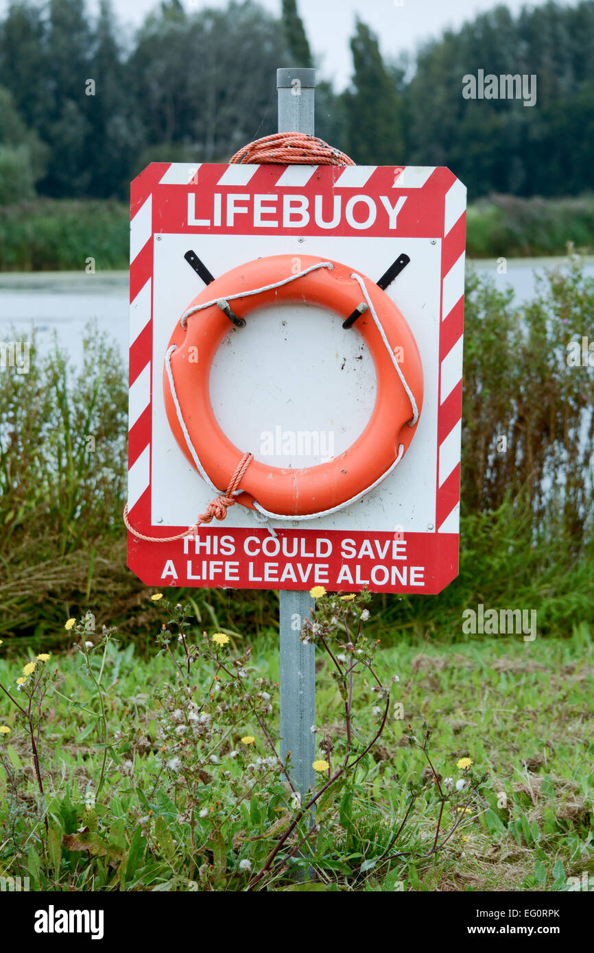 Lifebuoy safety feature at side of lake Stock Photo - Alamy