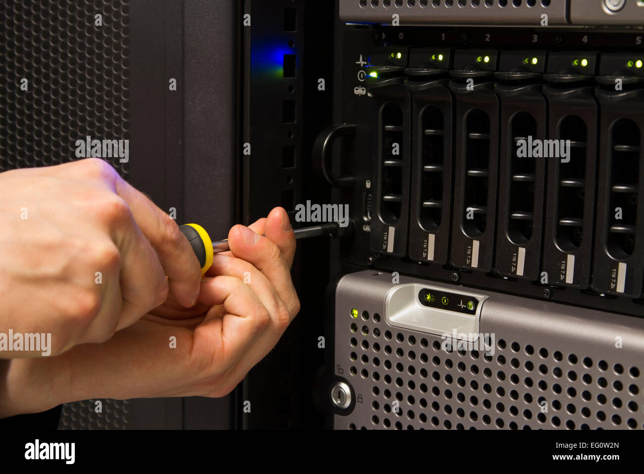 Installing server and disk cabinet / SAN in rack at a data center Stock ...