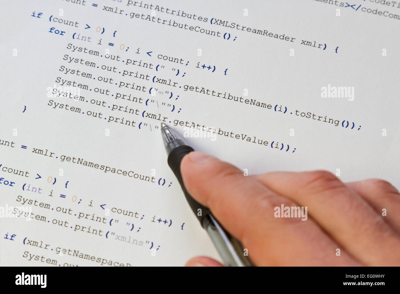 A Programmer Man Pointing With His Pen At Software Computer Code Software Application