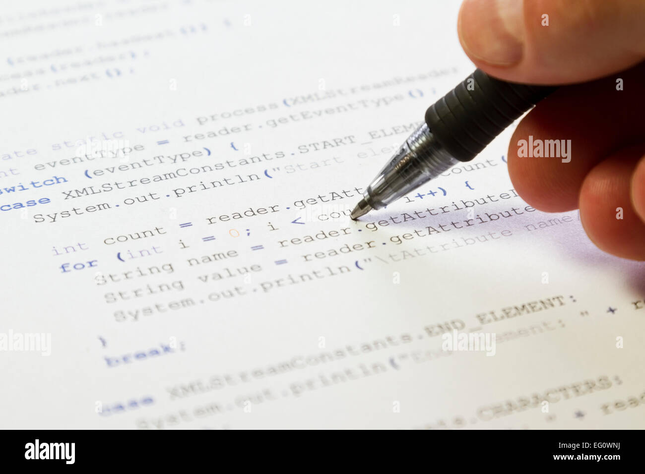 A Programmer Man Pointing With His Pen At Software Computer Code Software Application