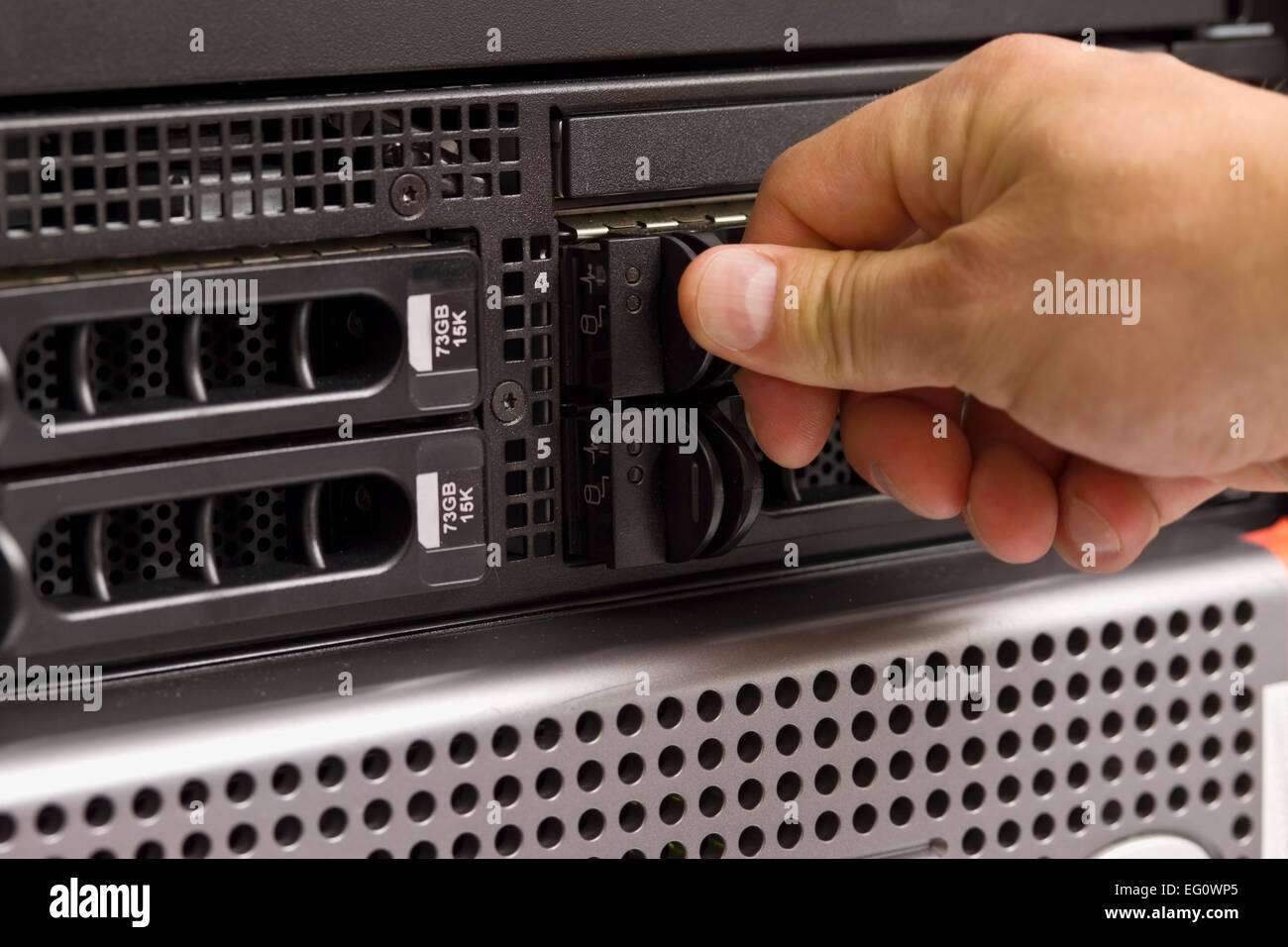 IT technician / consulant insert / remove a harddisk from a rack server ...