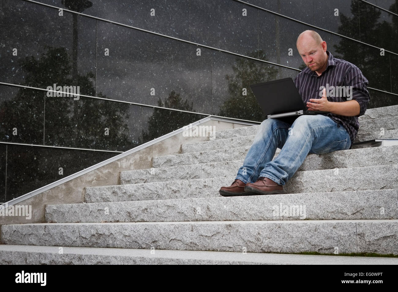 Banging your head against a computer hi-res stock photography and ...