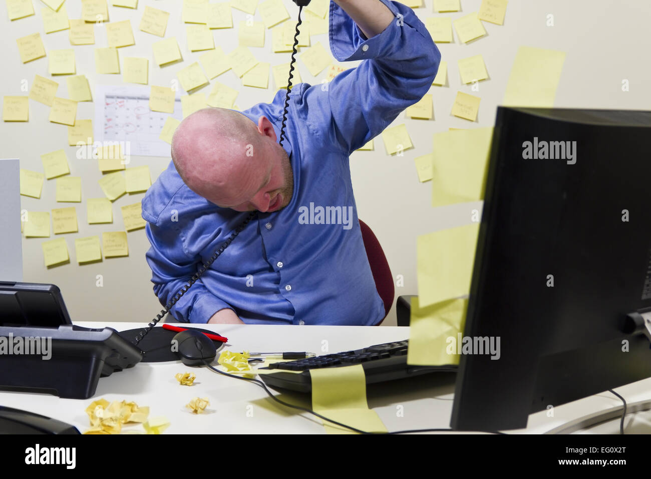 Young man strangling himself hi-res stock photography and images - Alamy