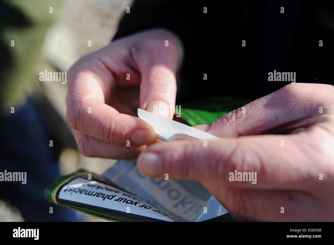 Woman smoking roll up cigarette hi-res stock photography and images - Alamy