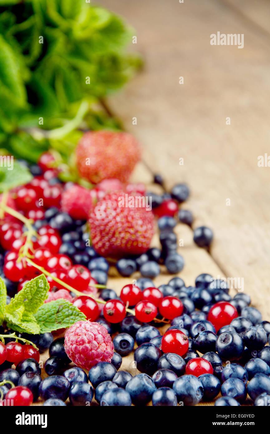 Bright summer frame of fresh sweet berries on the table Stock Photo - Alamy