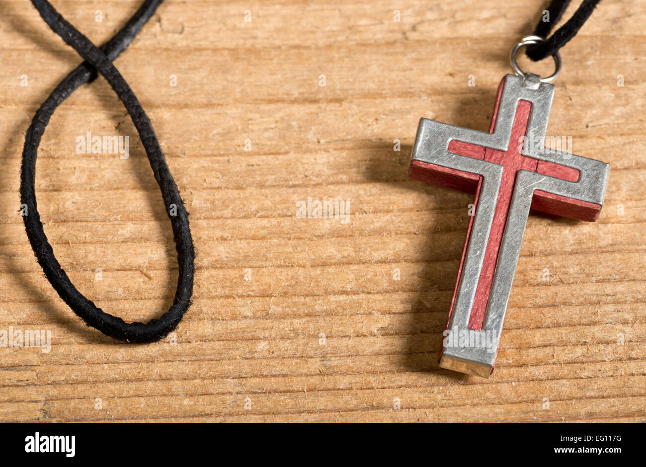 a cross on the old wooden desk Stock Photo - Alamy