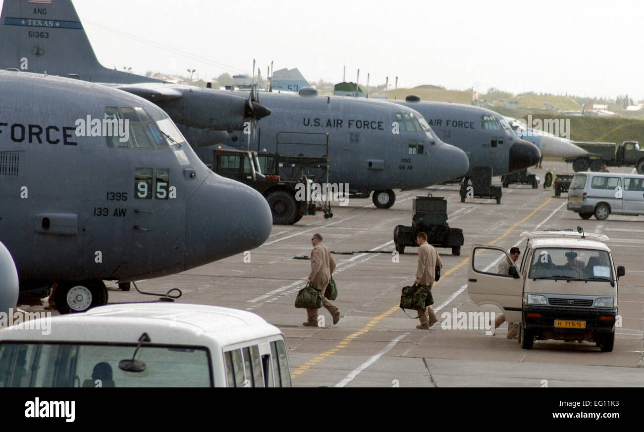 U.S. Air Force C-130 Hercules cargo aircraft aircrew members board ...