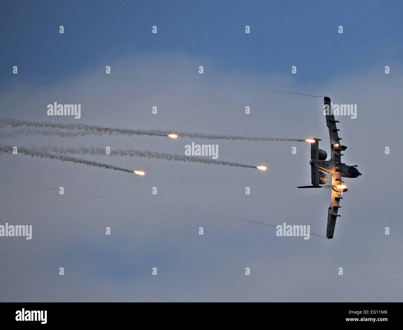 An A-10 Thunderbolt II fires flares as part of a combat search and ...