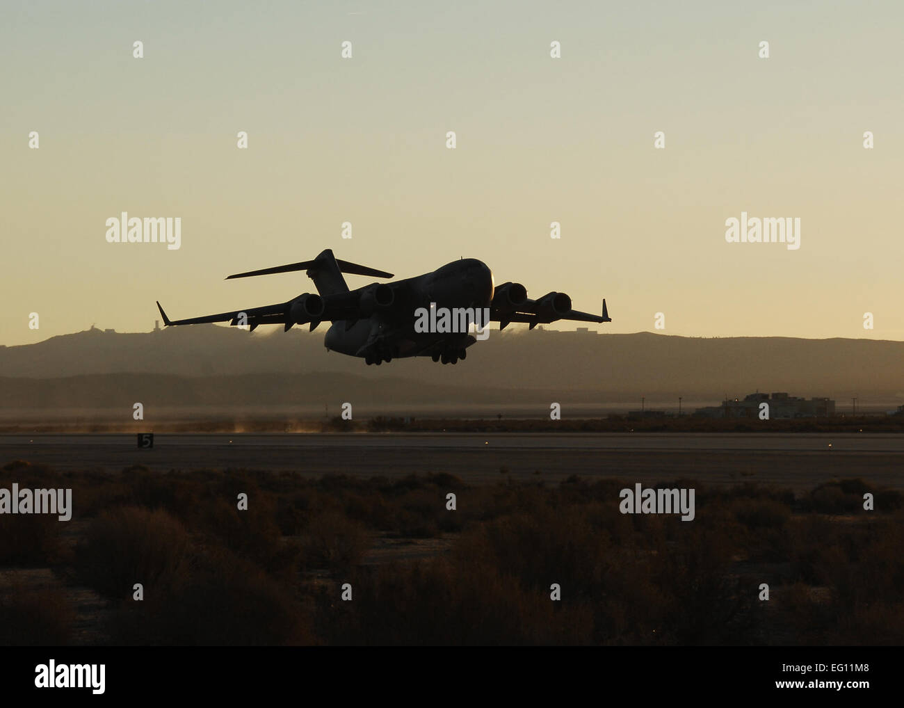A U.S. Air Force C-17 Globemaster III cargo aircraft takes off from Edwards Air Force Base ...