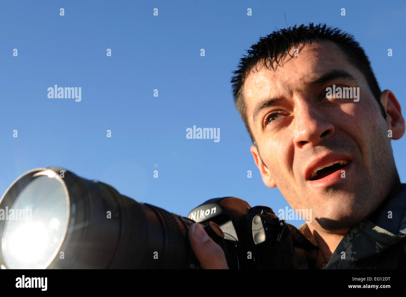 Senior Airman Daniel Owen, 1st Combat Camera Squadron, looks for his ...