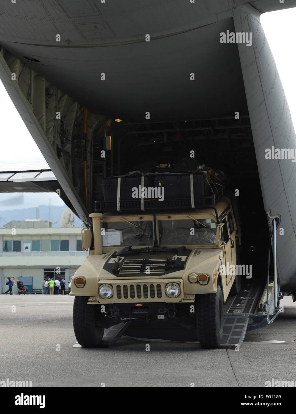 A Humvee is rapidly deployed from a 41st Airlift Squadron C-130J during ...