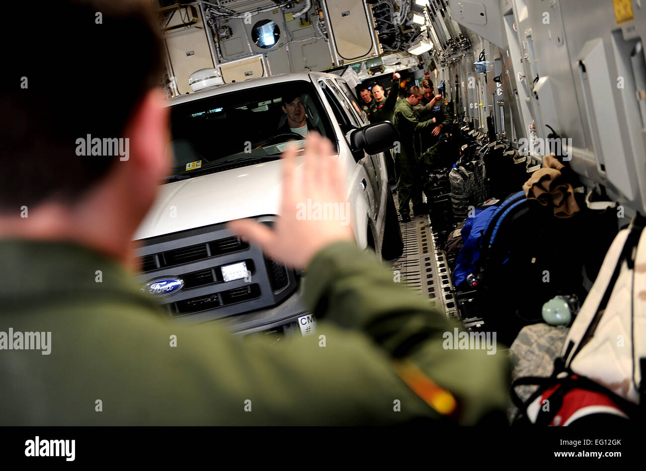 C-17 Loadmaster Staff Sgt. Benjamin Cato from the 21st Airlift Squadron ...