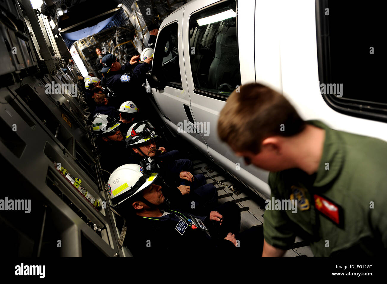 Members from the Virginia Task Force 2 Urban Search and Rescue board a C-17 Globemaster from the ...