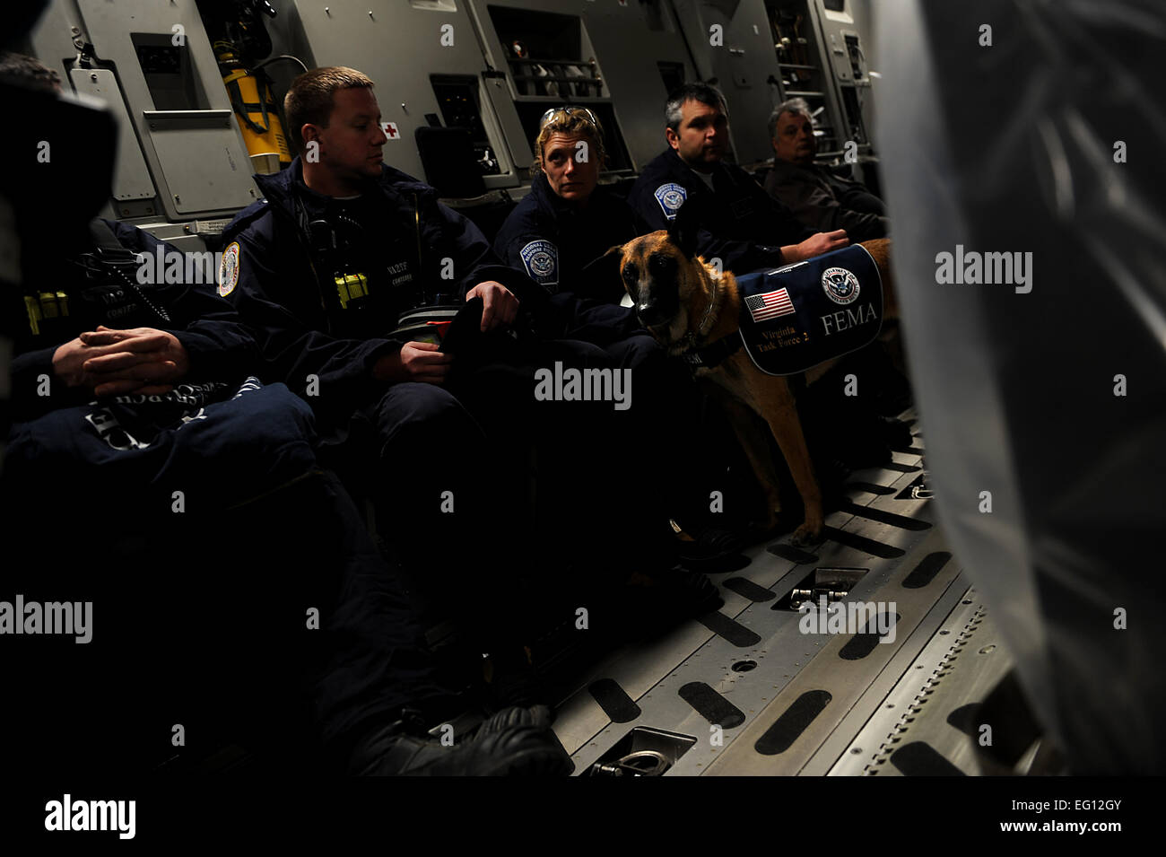 Members from the Virginia Task Force 2 Urban Search and Rescue board a C-17 Globemaster from the ...