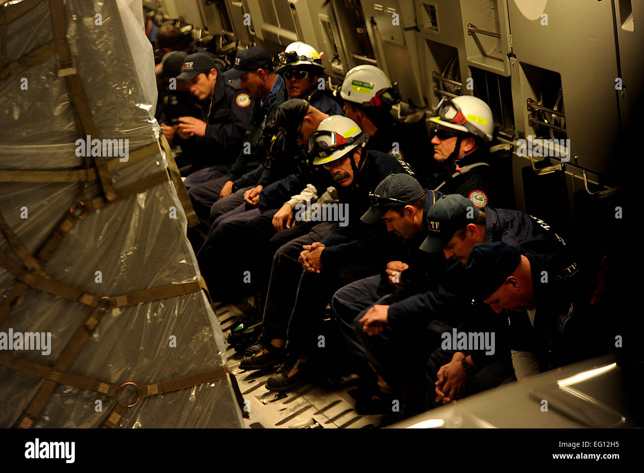 Members from the Virginia Task Force 2 Urban Search and Rescue board a C-17 Globemaster from the ...