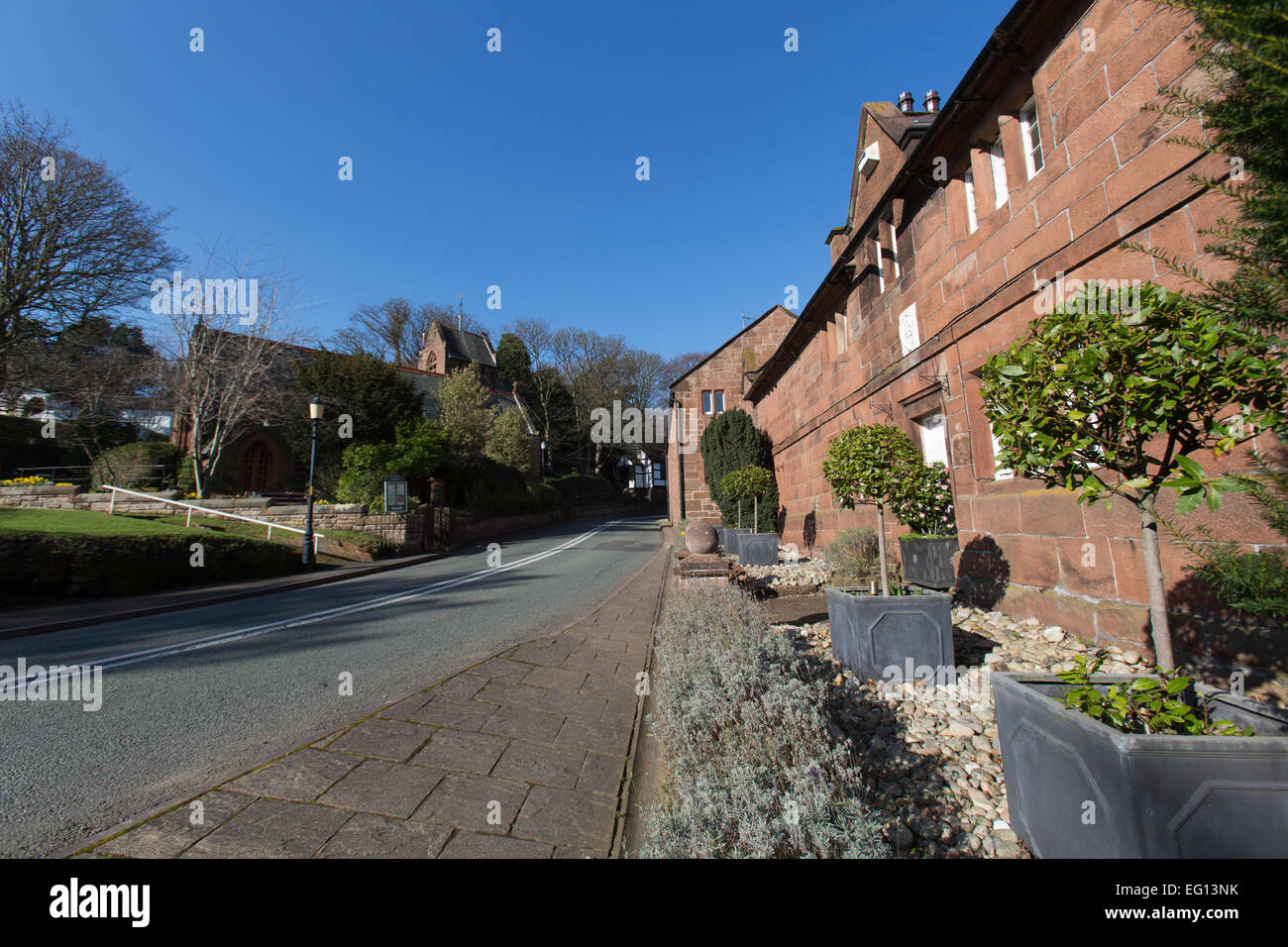 Village of Caldy, Cheshire. Picturesque view of the B5141 road running ...