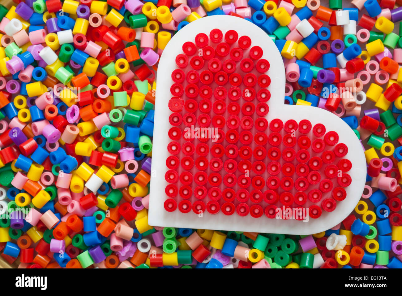 plastic multi coloured Hama beads with red heart completed template for ...