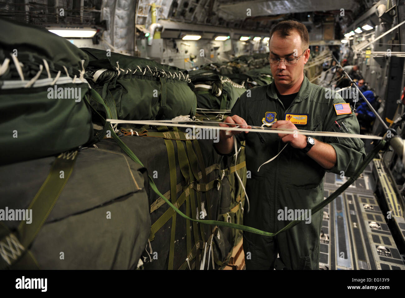 100118-F-2034C-011 Tech. Sgt. Aaron Avery attaches de-oscillation ties ...