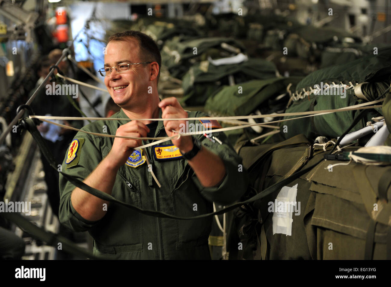 100118-F-2034C-024 Tech. Sgt. Aaron Avery attaches de-oscillation ties ...