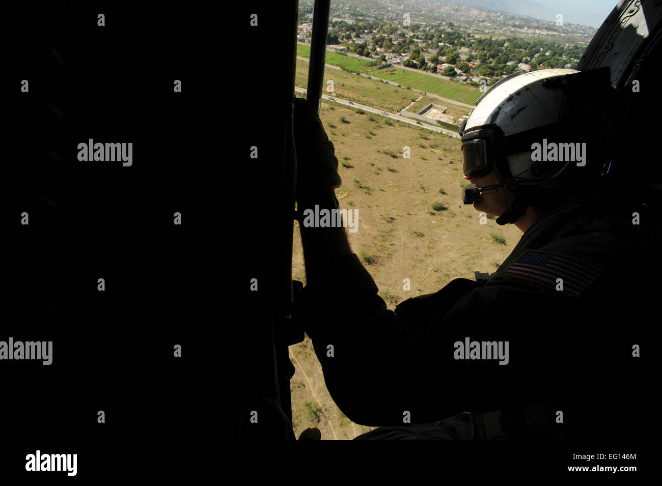 U.S. Navy AWR1 Scott Hatch, a U.S. Navy HH-60 Aircrew member from ...