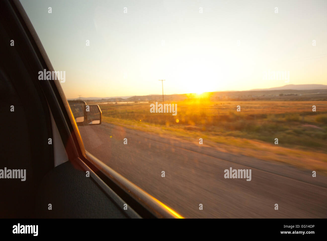 Sunrise out the window of a moving vehicle Stock Photo - Alamy