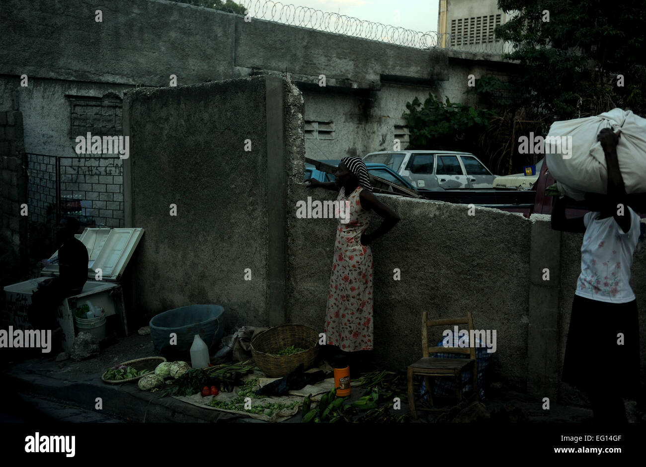 A Haitian woman selling vegetables stands in the street in Port-au ...