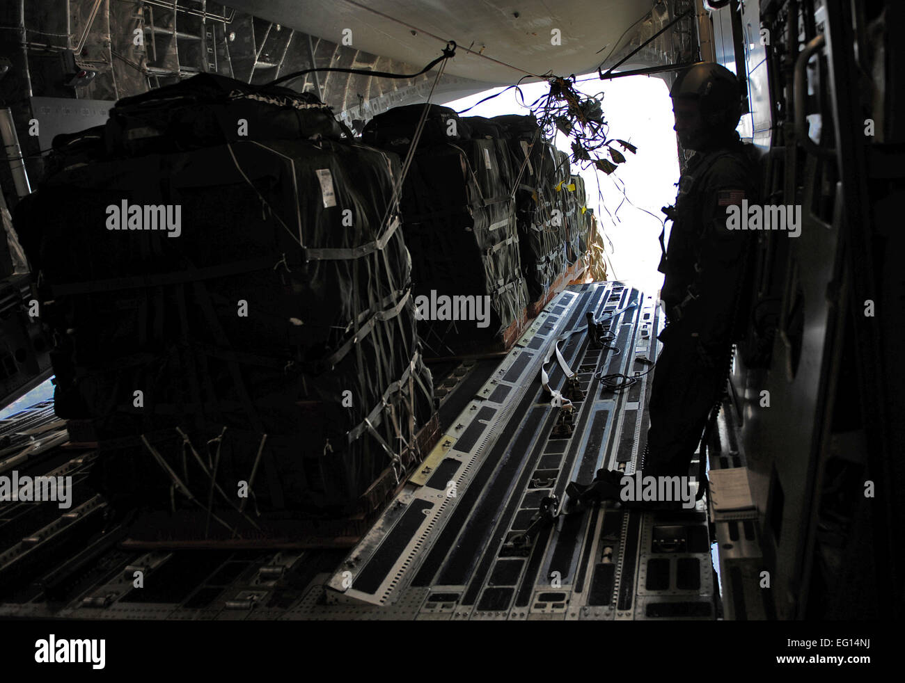 Container delivery system bundles exit a C-17 Globemaster III aircraft ...