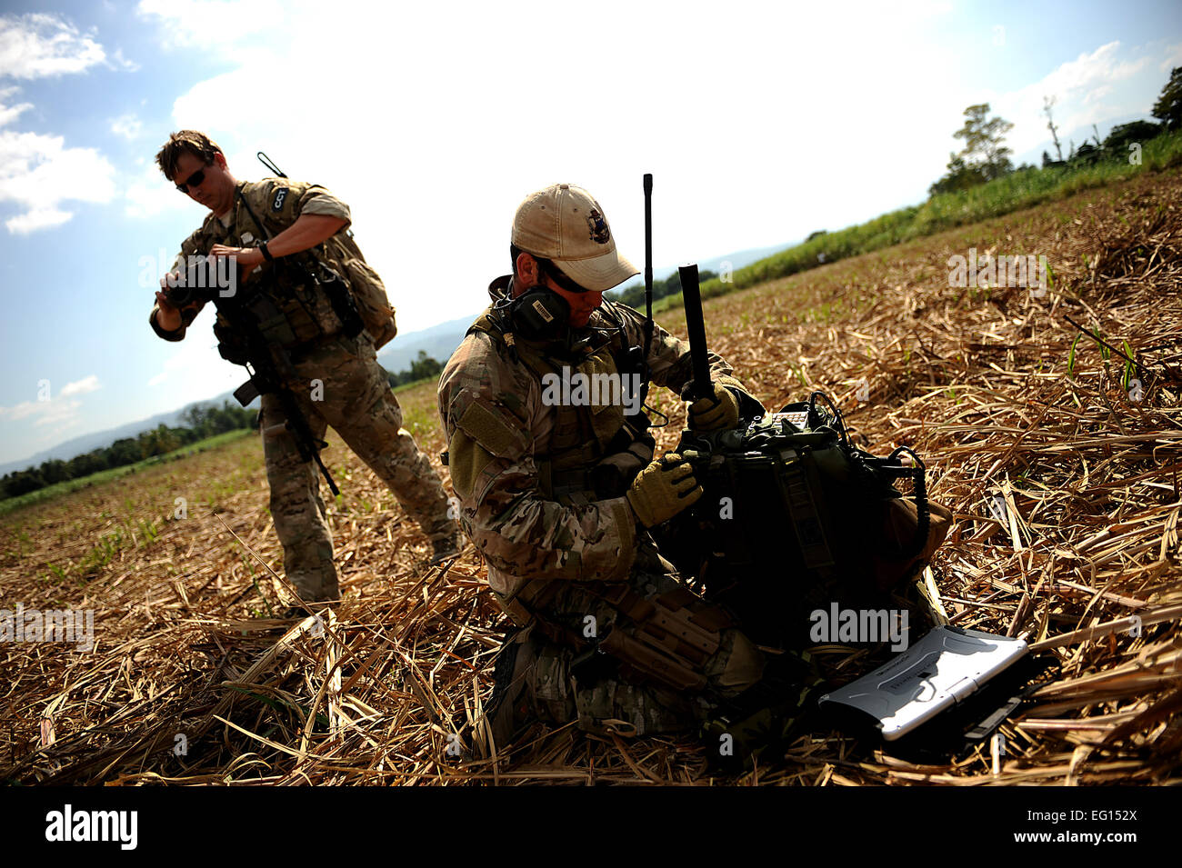 A U.S. Air Force Combat Controller prepares to radio back to the ...