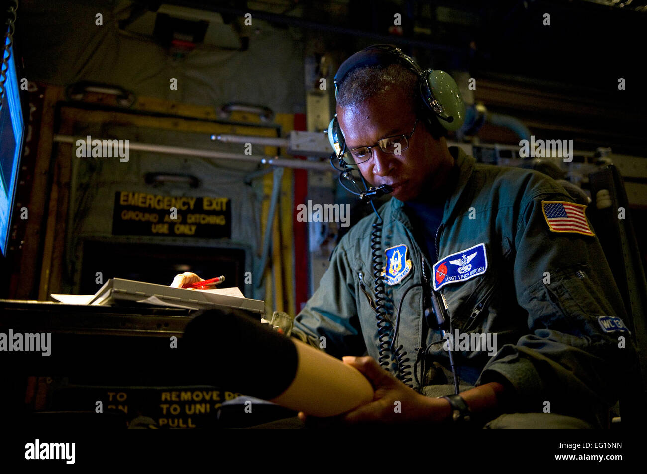 Master Sgt. Vince Burden logs the dropsonde serial number onboard a WC ...