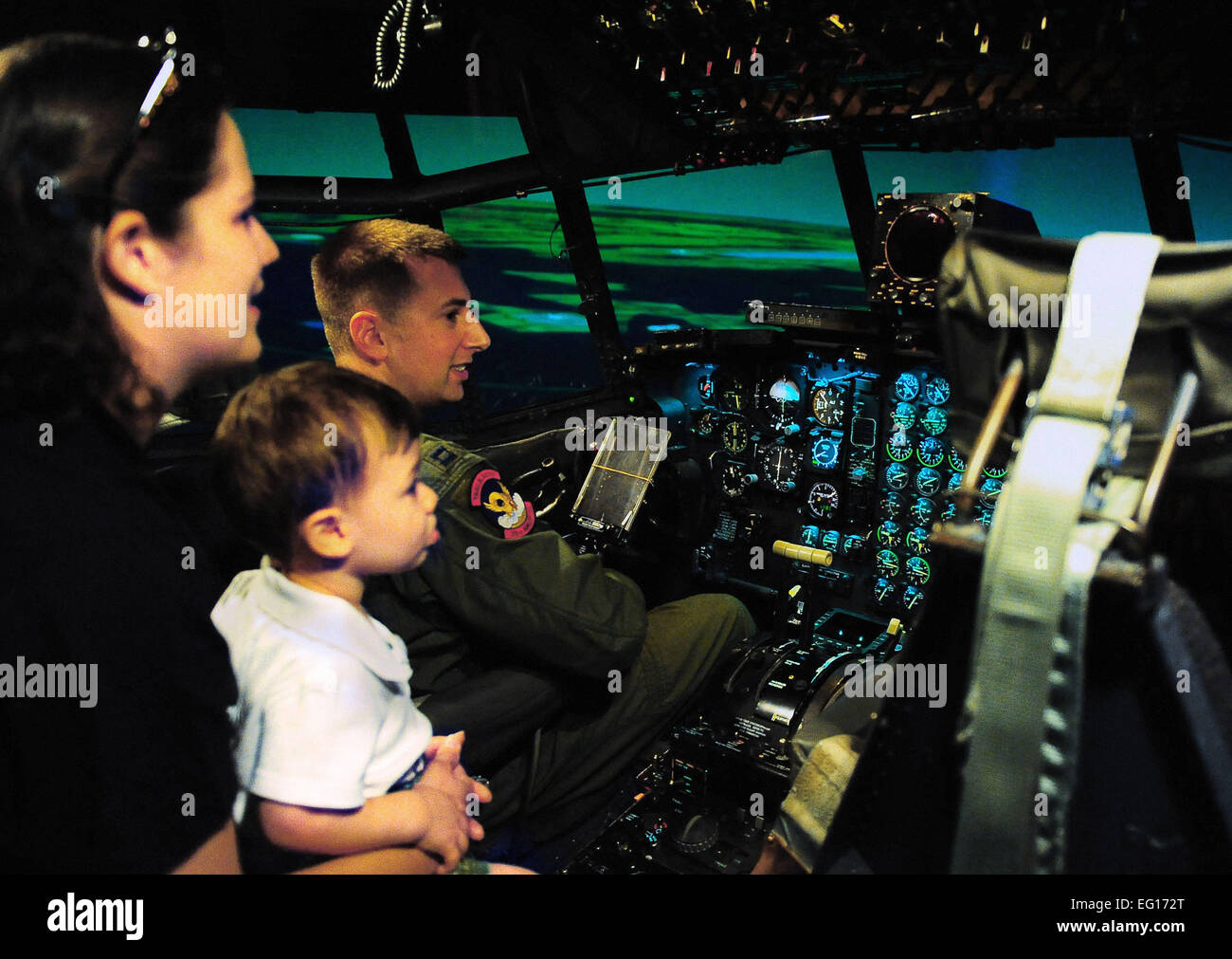 Capt. Mike Heddinger, 39th Airlift Squadron, shows Tracy Mitchell and ...