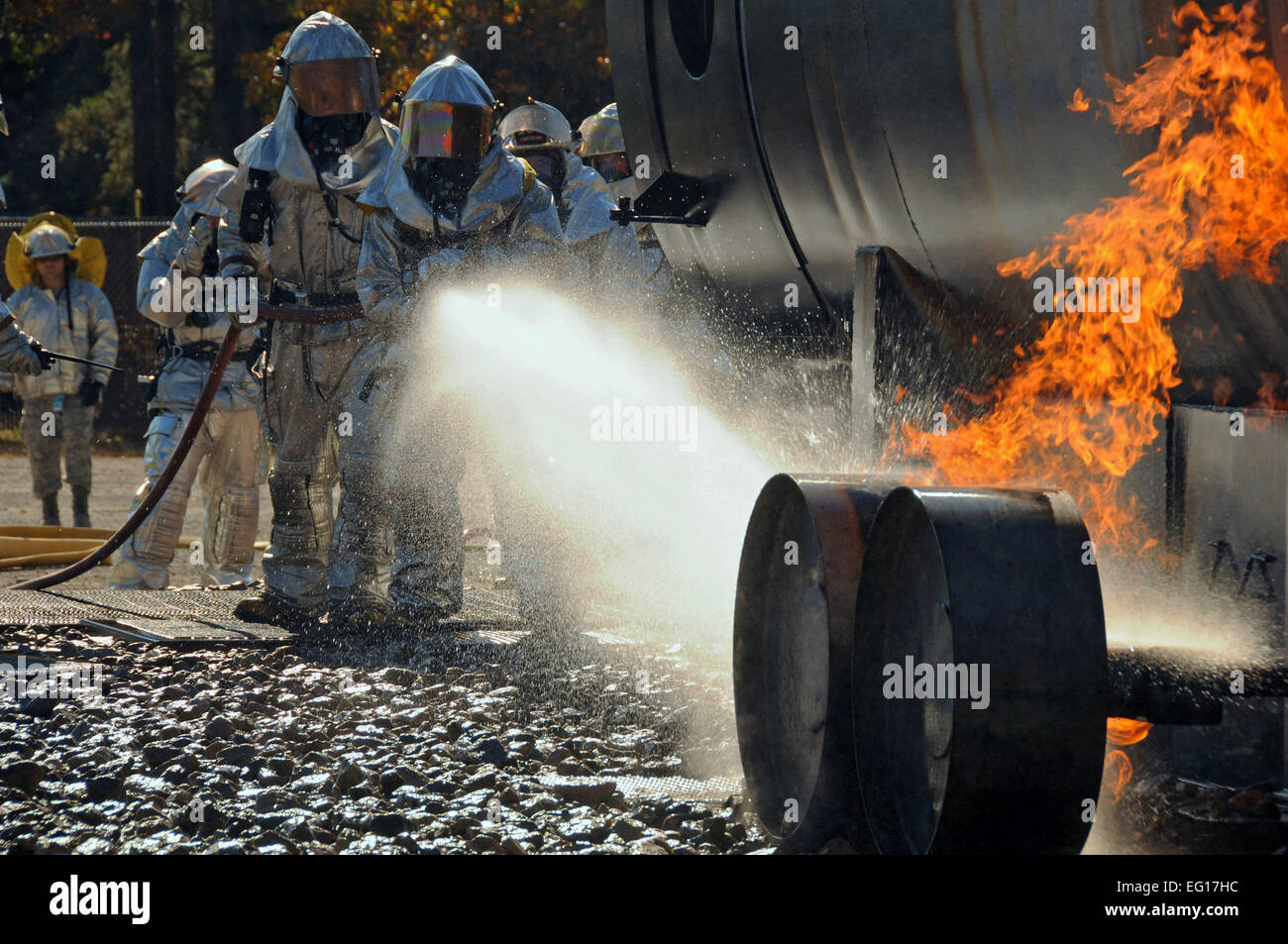 U.S. Air Force firefighters from the 180th Fighter Wing, extinguish an ...