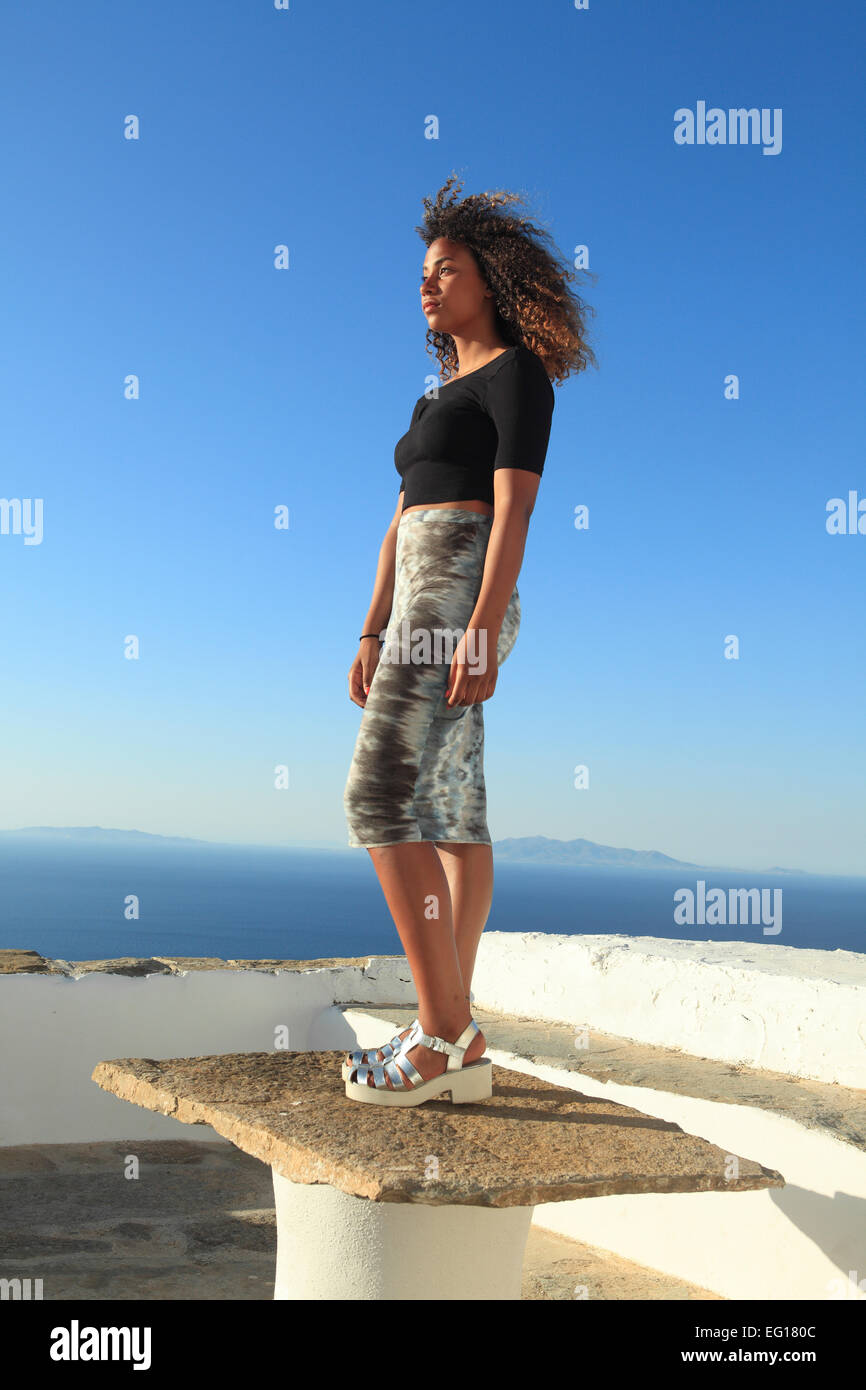 greece a young mixed race girl posing on holiday Stock Photo - Alamy