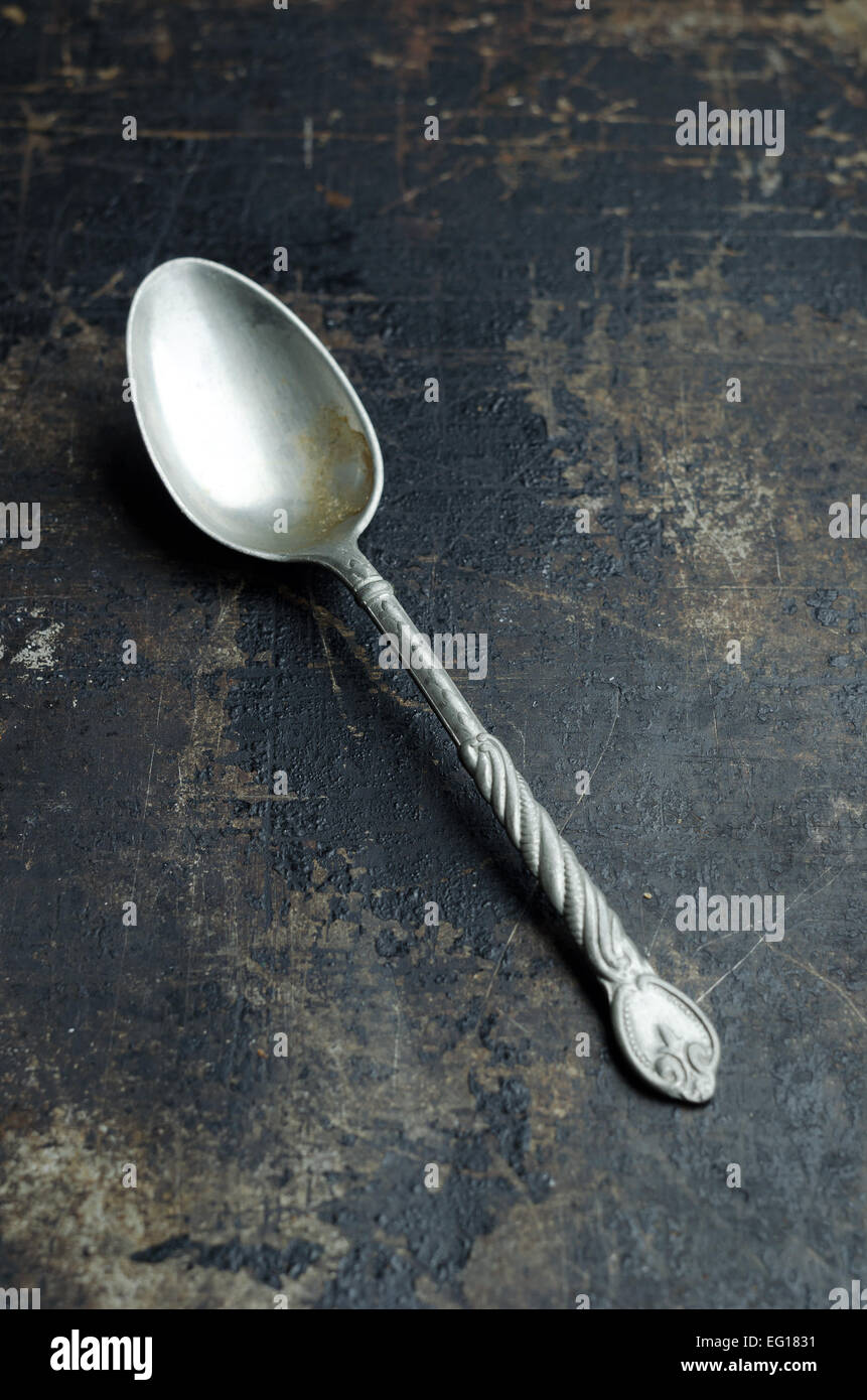 Close up of a teaspoon over dark grunge background Stock Photo - Alamy
