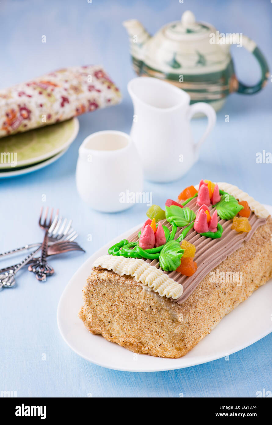 Roulade cake, decorated with colourful buttercream flowers. Yule Log ...