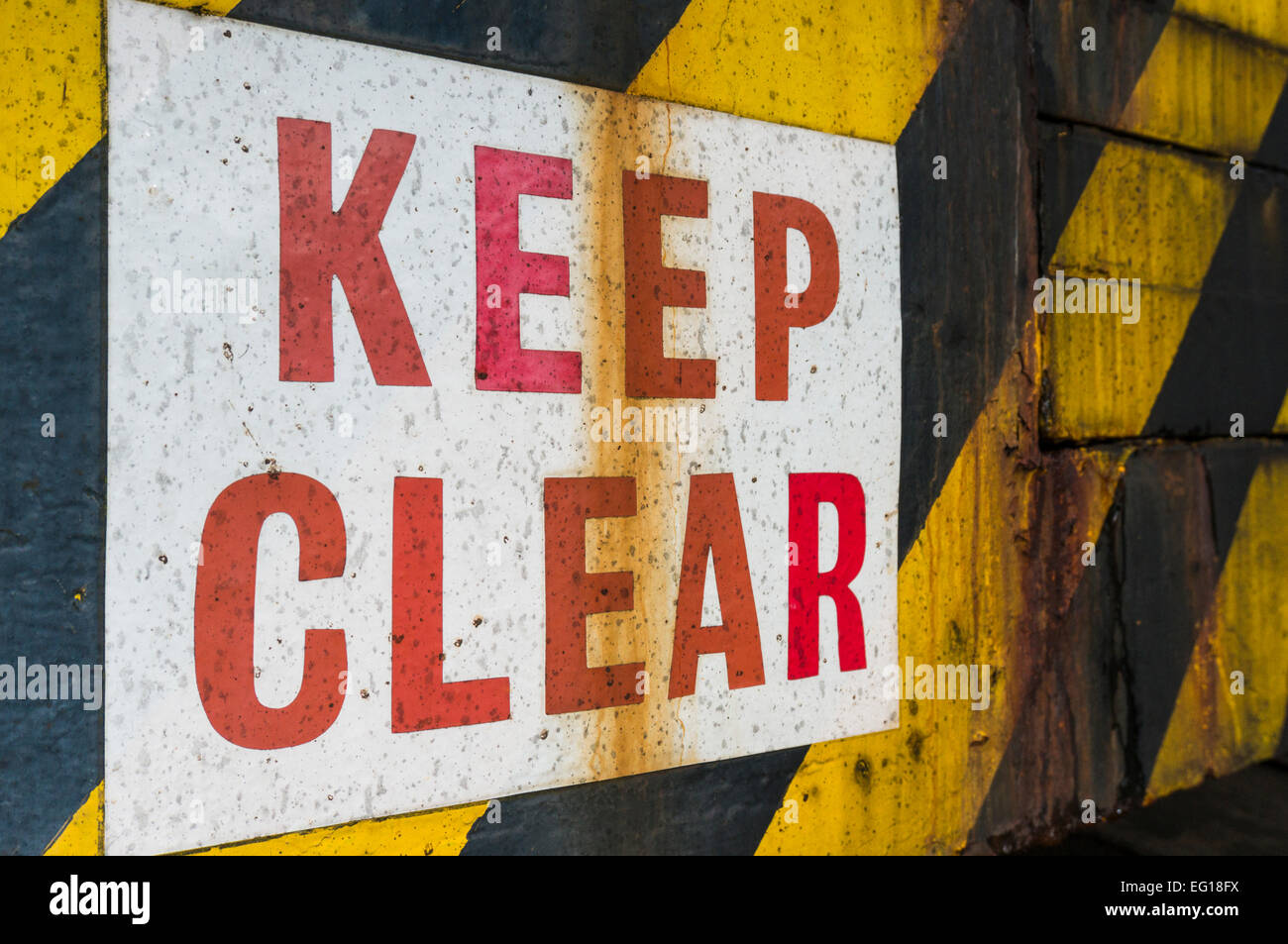 Keep Clear warning sign on the side of a machine Stock Photo - Alamy