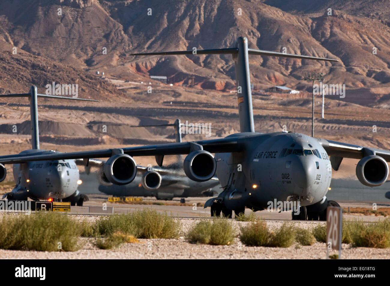 U.S. Air Force C-17 Globemaster III aircraft line up on the Nellis Air ...
