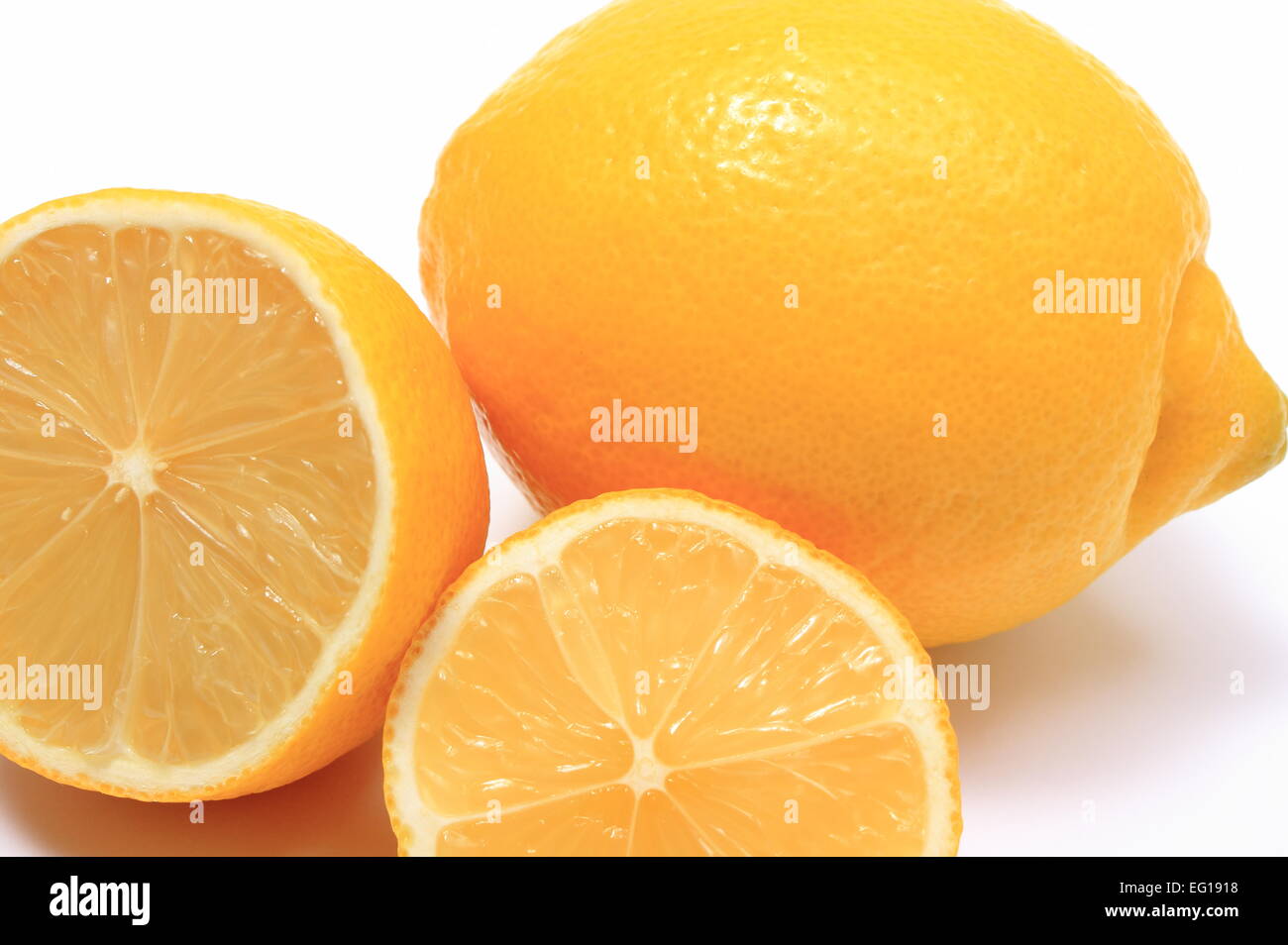 Whole and half of fresh lemons on white background, citrus, concept for ...