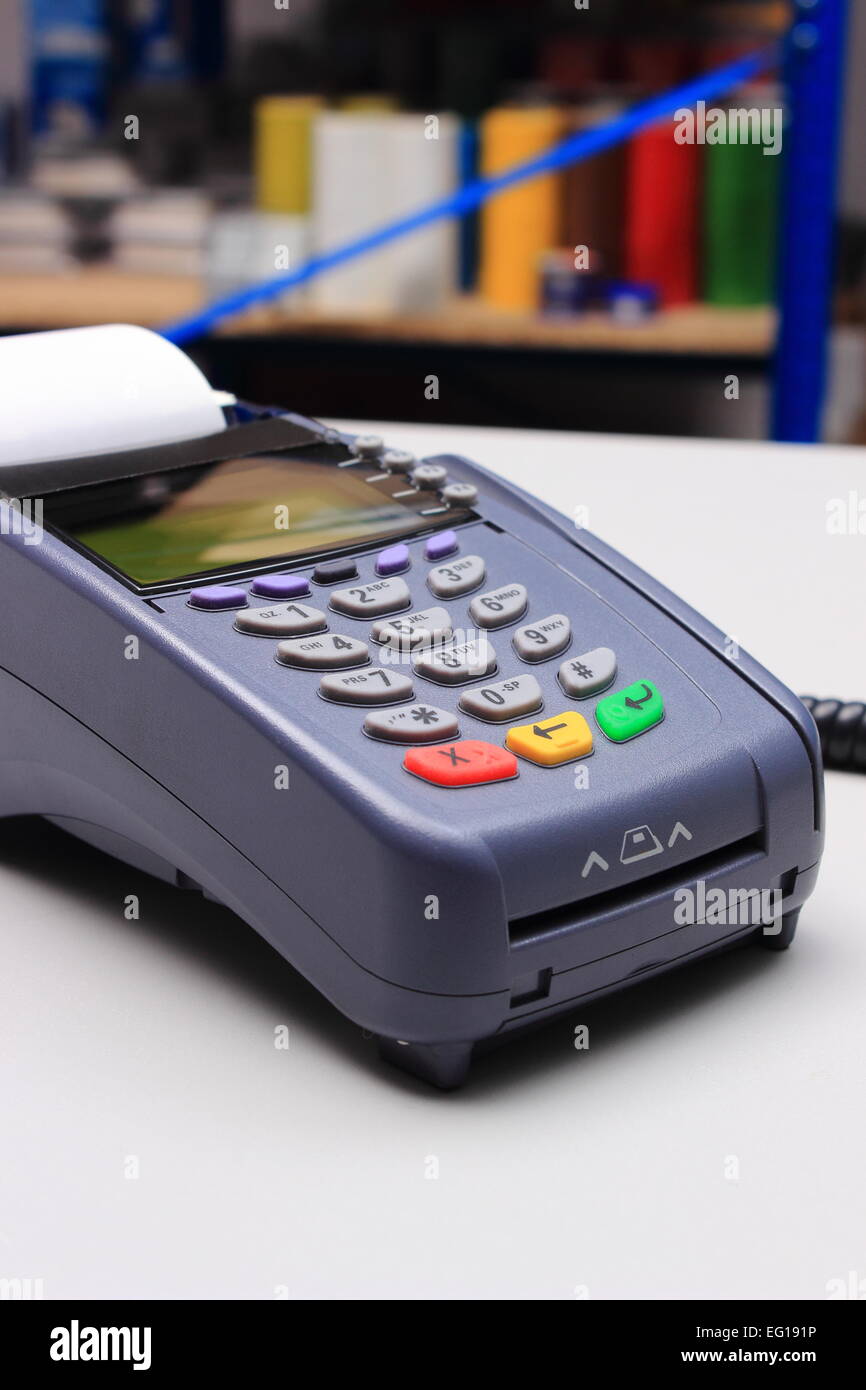 Credit card reader on desk in shop, payment terminal, finance concept ...