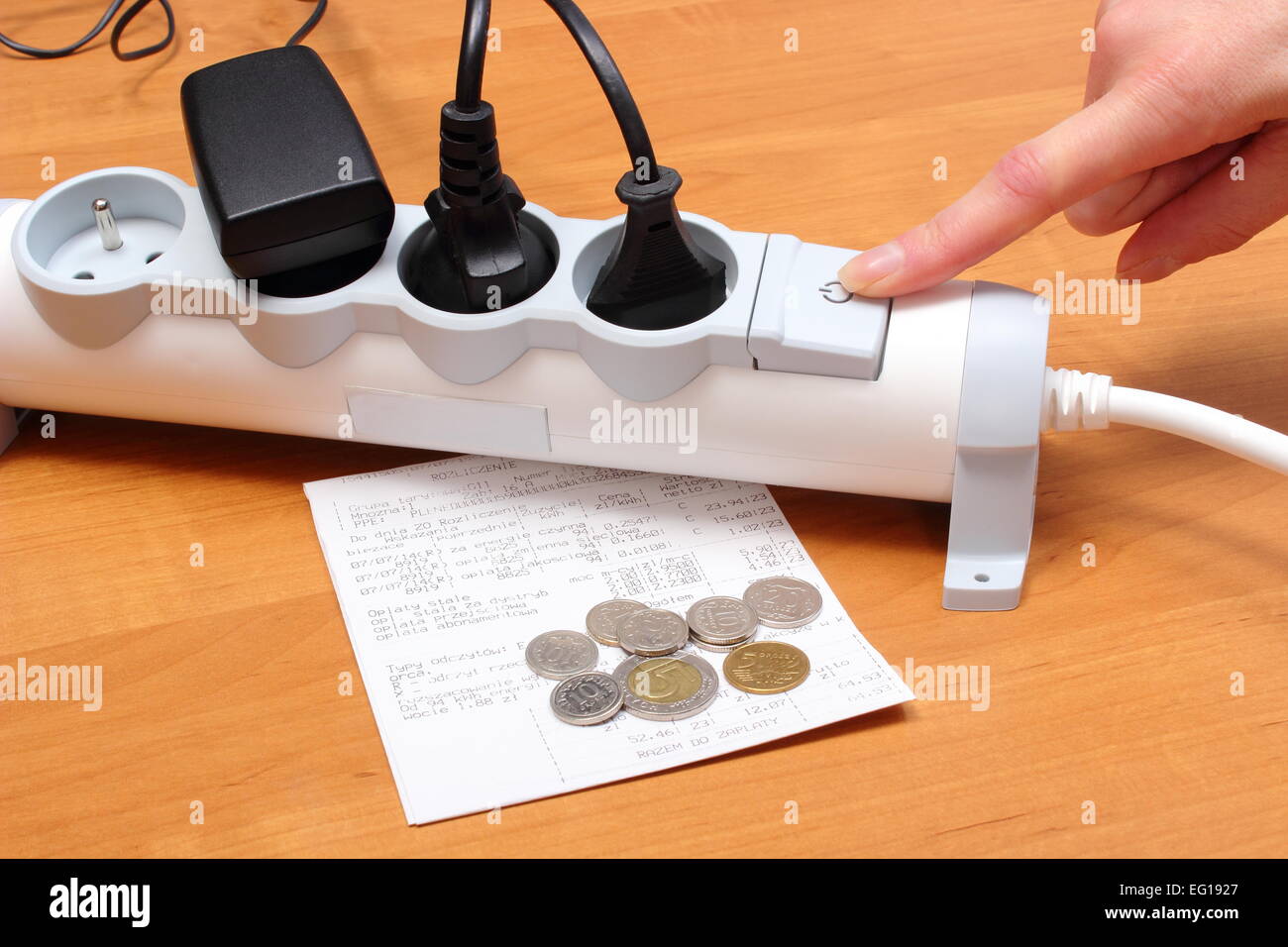 Finger of woman turns off electrical extension, electrical plugs ...