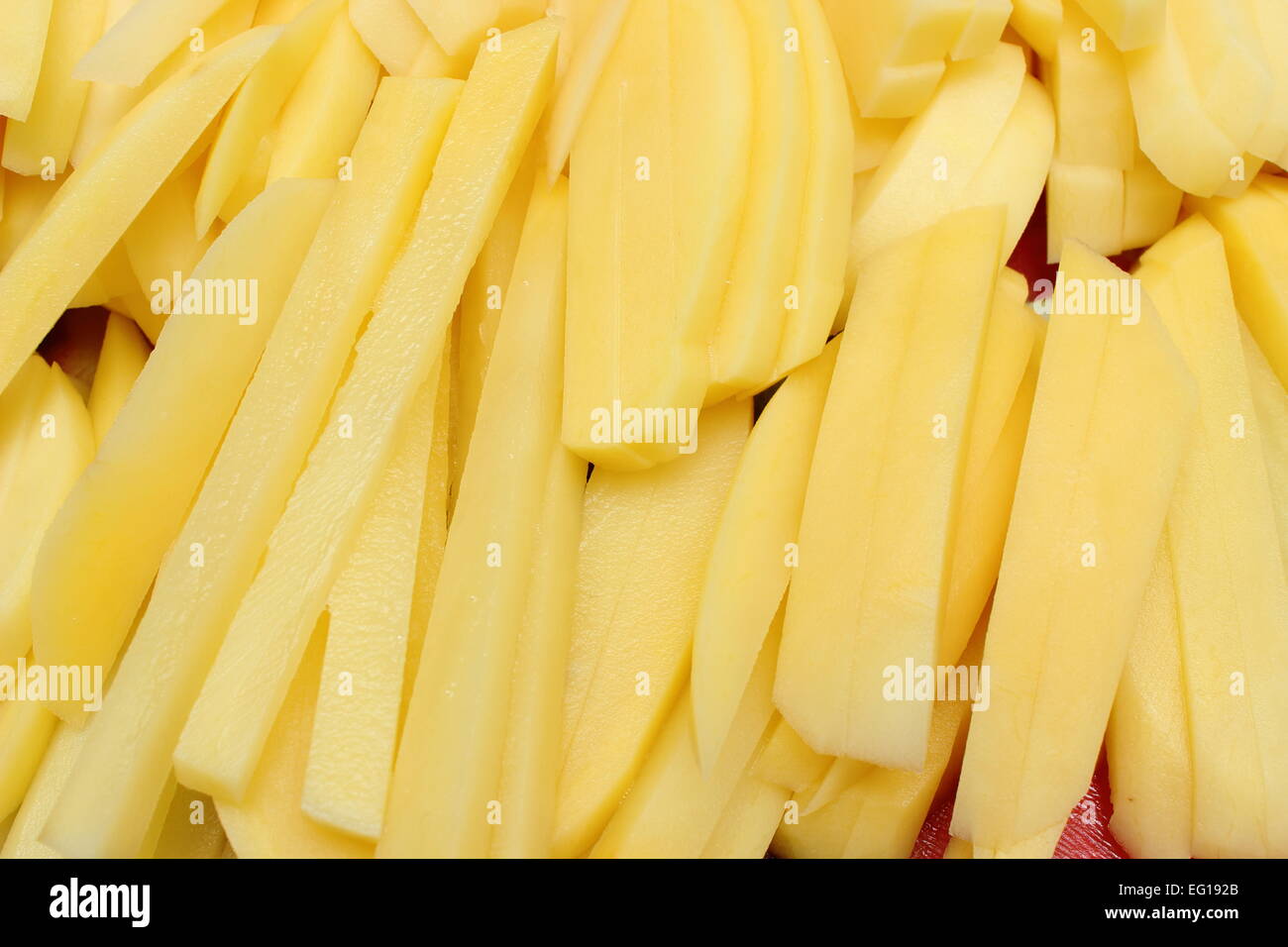Heap of raw french fries as background Stock Photo - Alamy