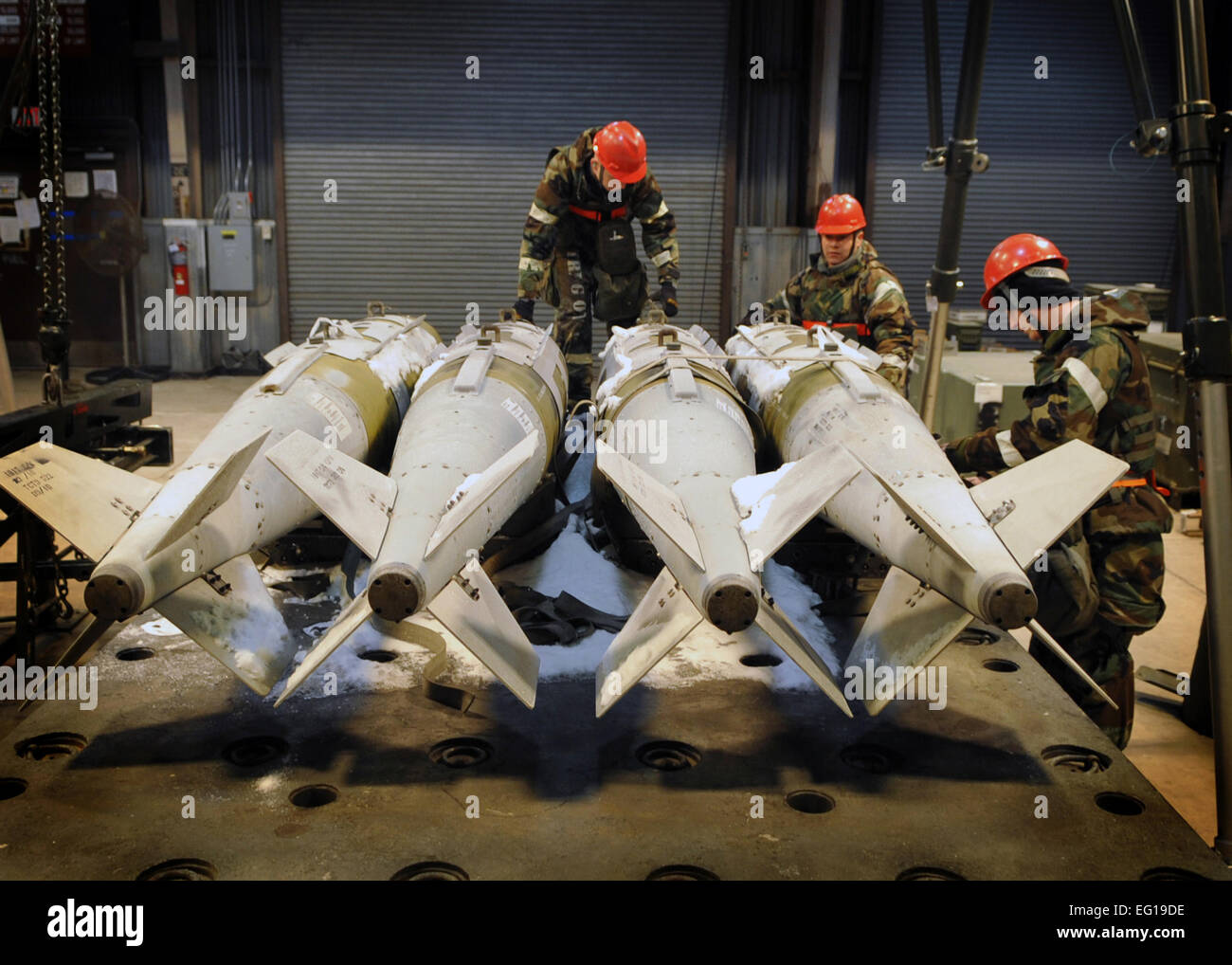 Airmen from the 51st Munitions Squadron unload guided bomb units GBU's ...