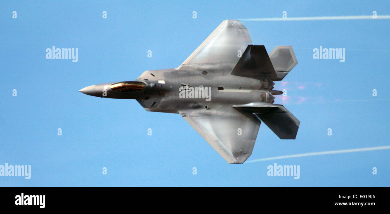 An F-22 Demonstration Team Raptor streaks across the sky above Langley ...