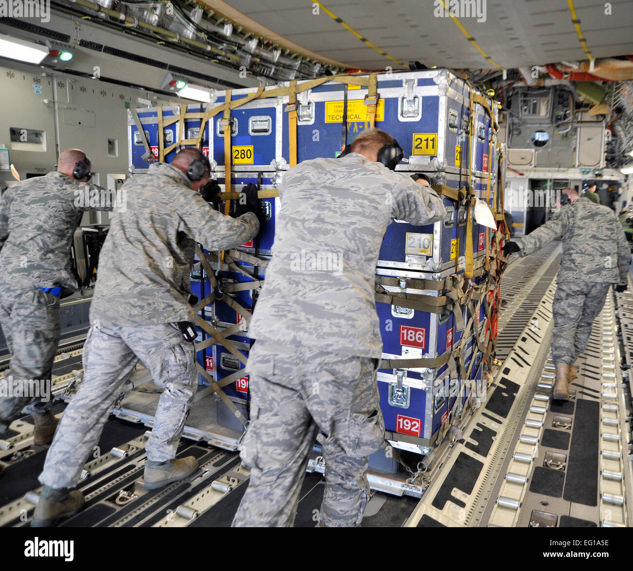 Airmen from the 89th Aerial Port Squadron load pallets onto a U.S. Air ...